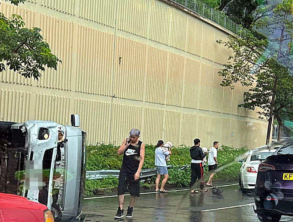 Van topples in rain on Lung Cheung Road