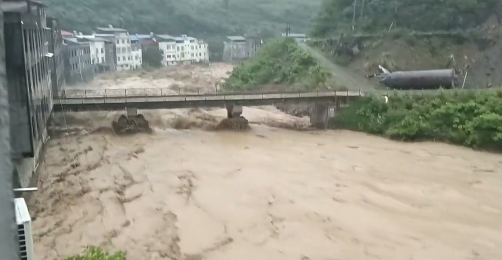 Railway bridge partly collapses in China's Chongqing as rain drenches ...