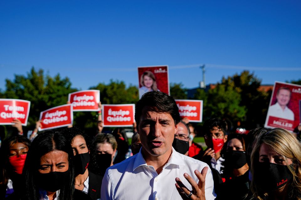 Canada's Trudeau hammers rival over Covid-19 stance on last day of campaign
