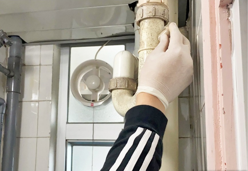Soapy water leak test on household pipes to prevent infection