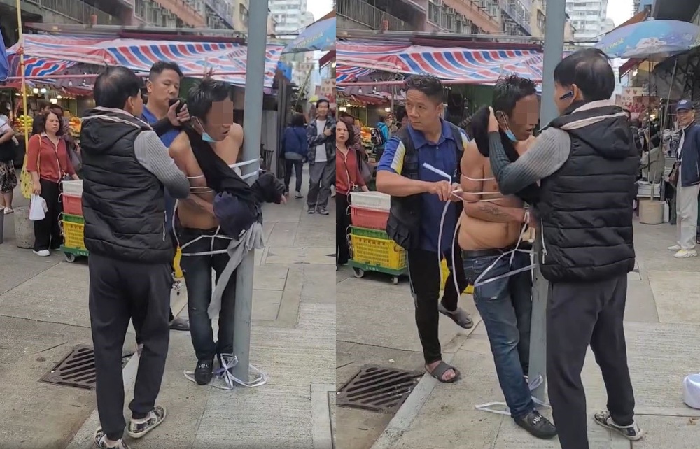 Shirtless man subdued and tied to street sign after trying to steal shampoo
