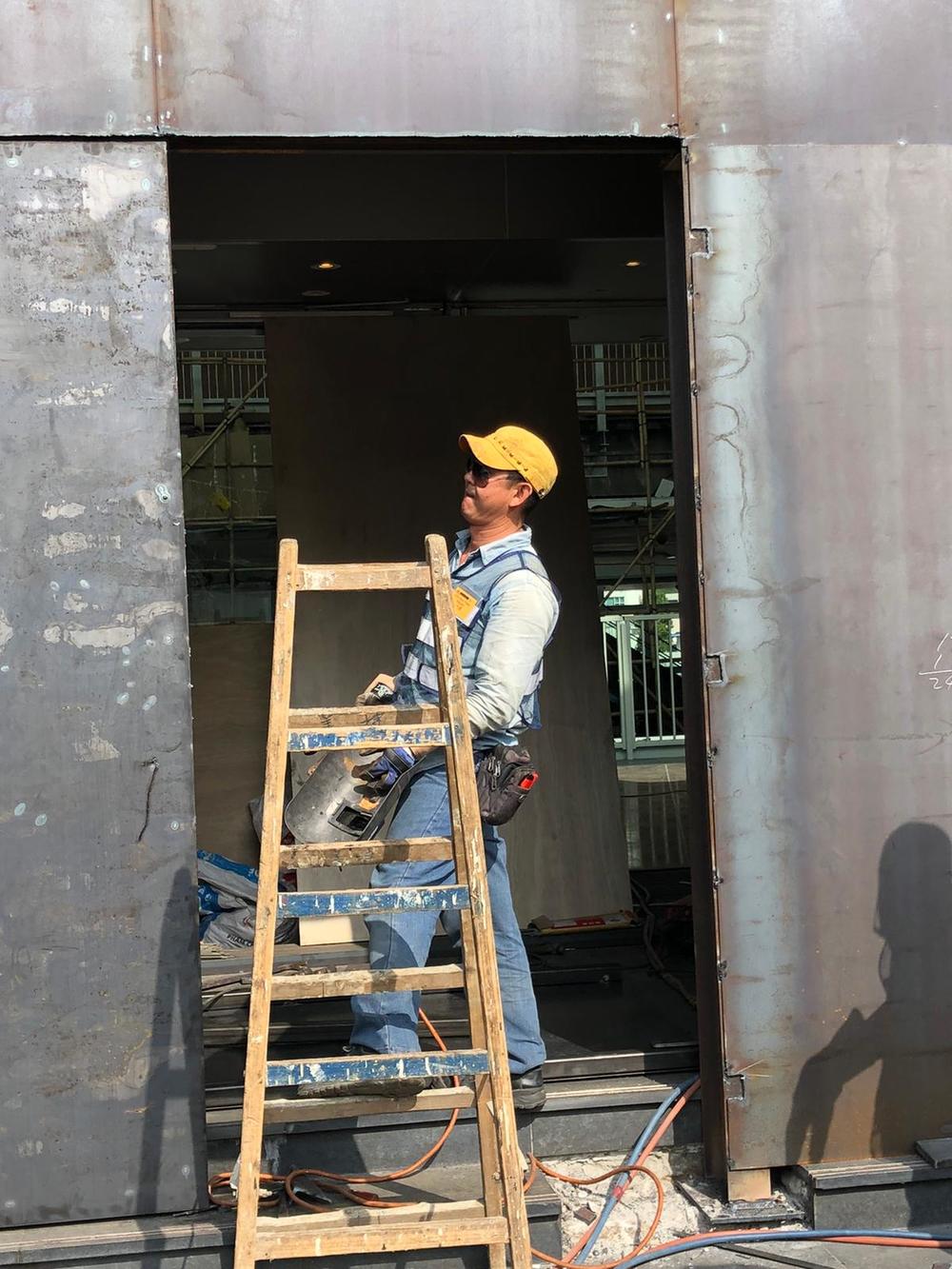 Construction workers rushing Festival Walk reopening