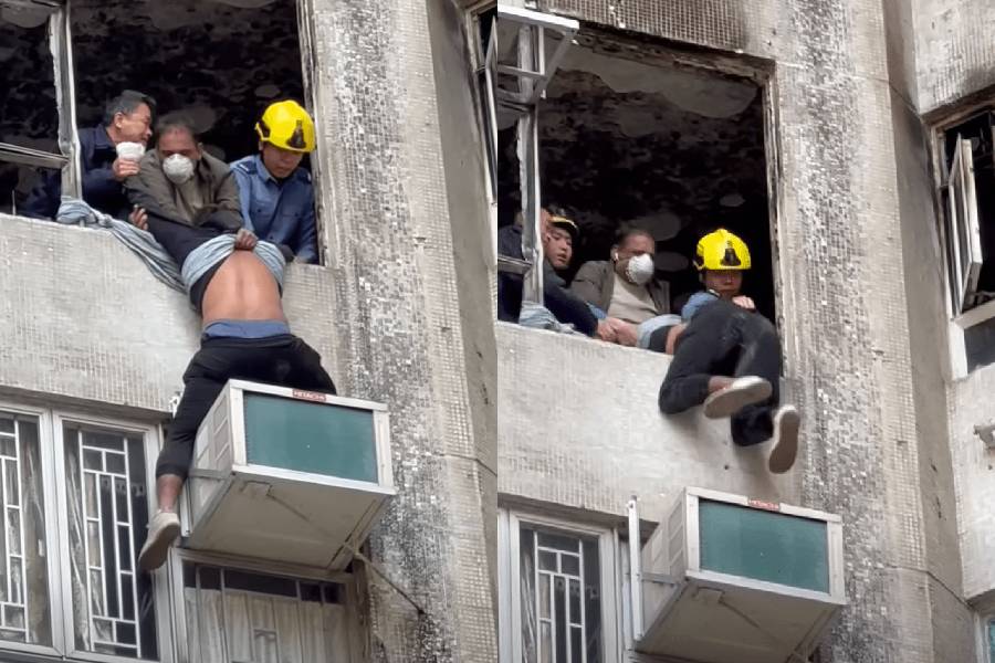 Man rescued after being trapped outside building wall in Tuen Mun