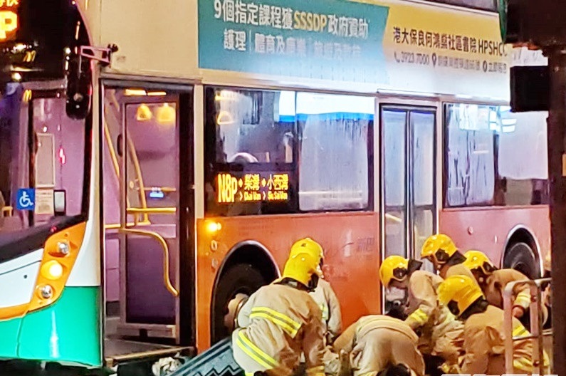 Man suspected of dying trapped under bus