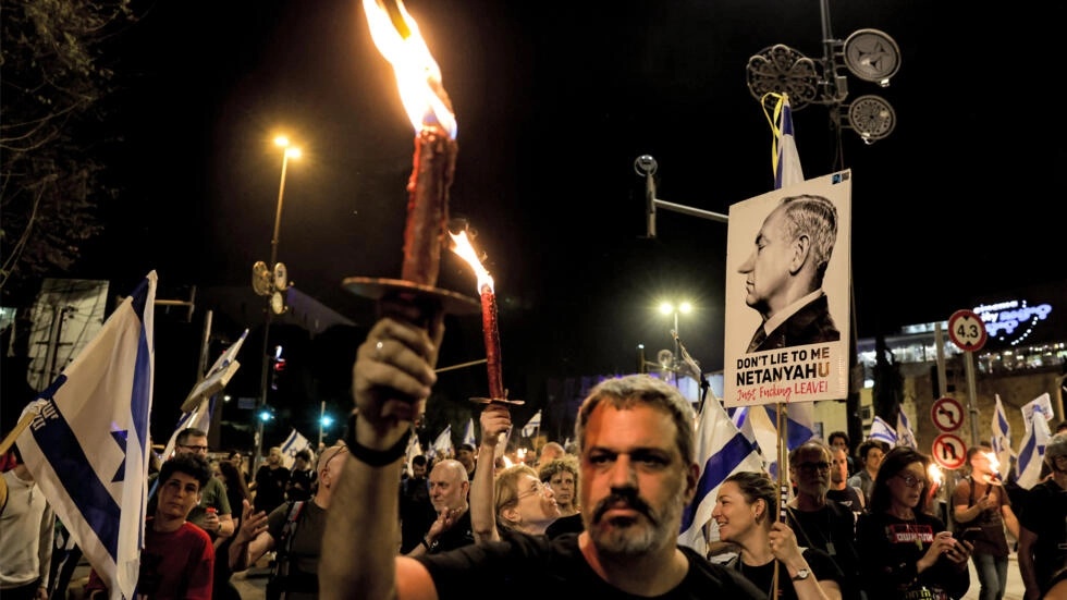 Netanyahu branded 'traitor' in fourth night of Israel protests