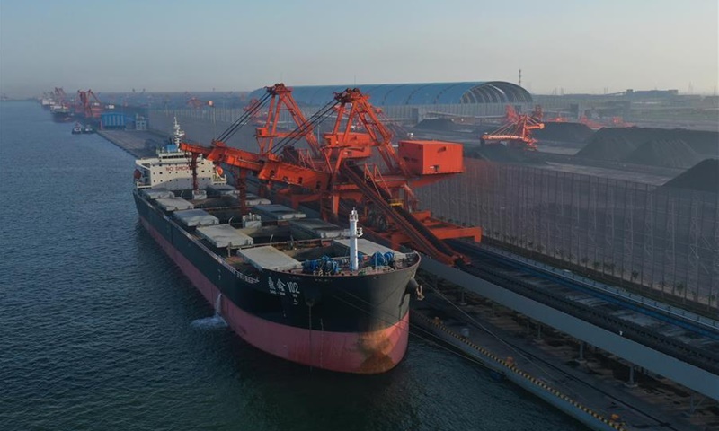 A powerful explosion sets off a fireball on a container ship at a ...