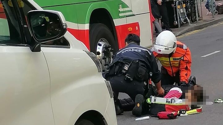 Elderly woman dies after being dragged under tour bus in Wan Chai