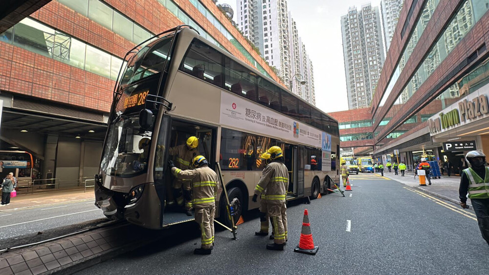 Two children among 12 injured after KMB bus mounts curb in Sha Tin