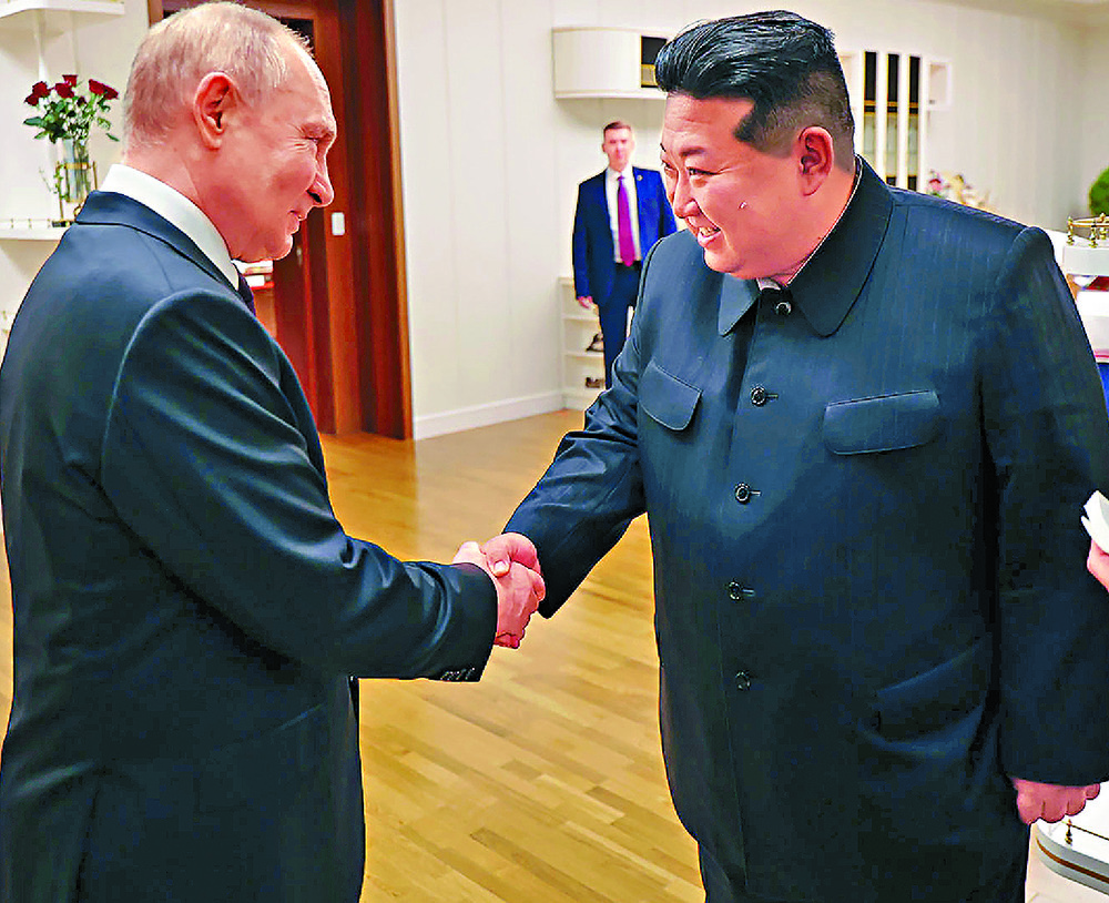 Putin seals mutual defense pact in N Korea
