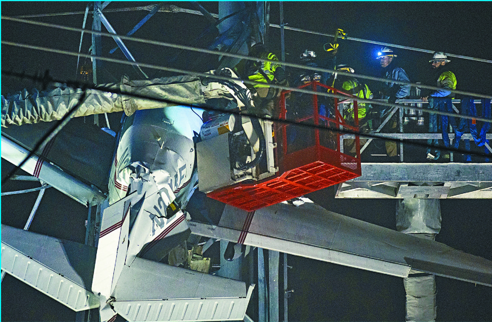 High-wire rescue for two in trapped plane