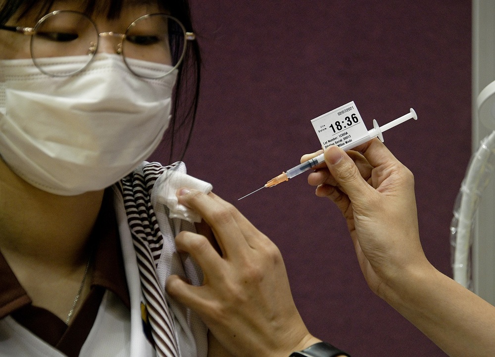 Four teenagers reported suspected heart conditions after jabs