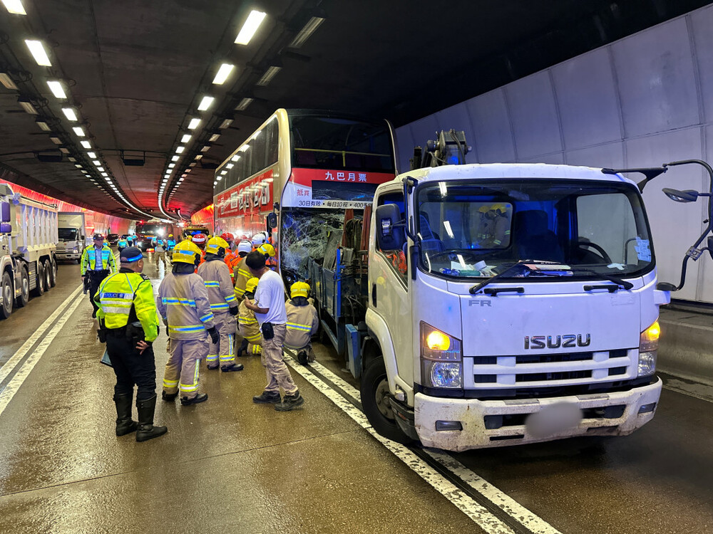 Bus driver trapped for hour after rear-ending boom truck at Tai Lam Tunnel