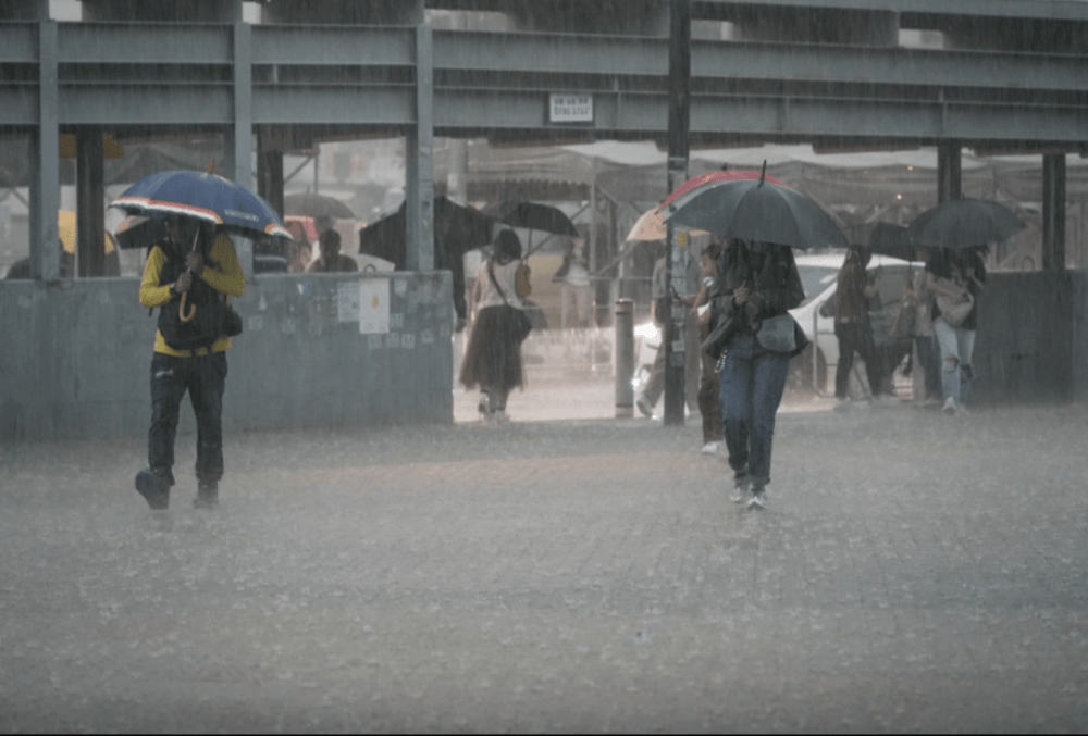 Hongkongers embrace rain and thunderstorms on Labour Day