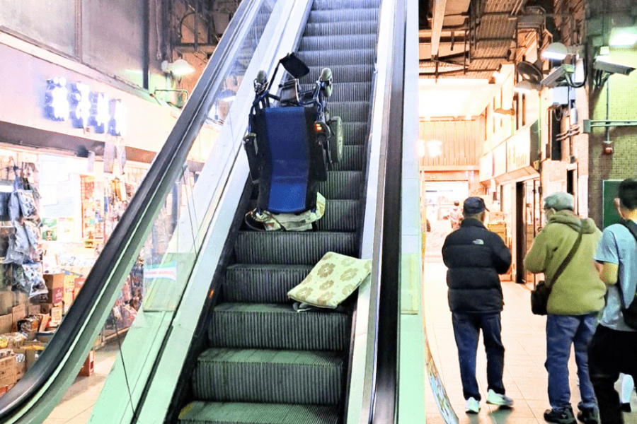 Elderly man in wheelchair tips backward on escalator at Tuen Mun mall