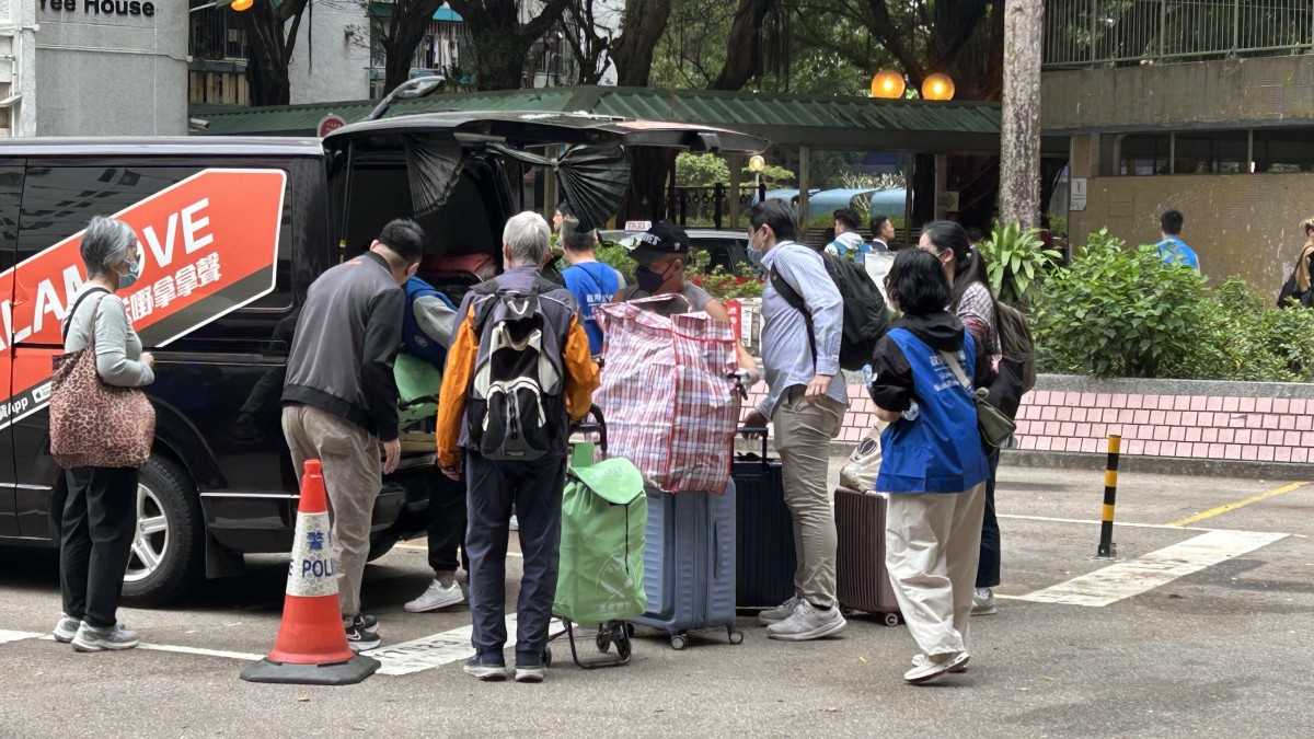 Wang Chi House residents return for personal belongings after Tai Po fire