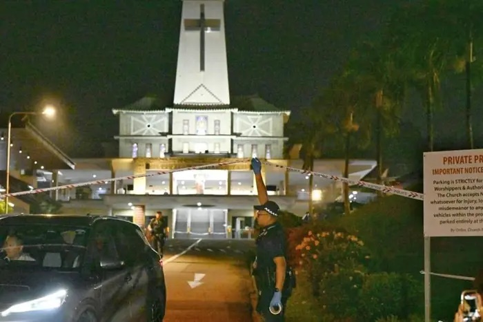 Singapore charges man with stabbing priest during Mass