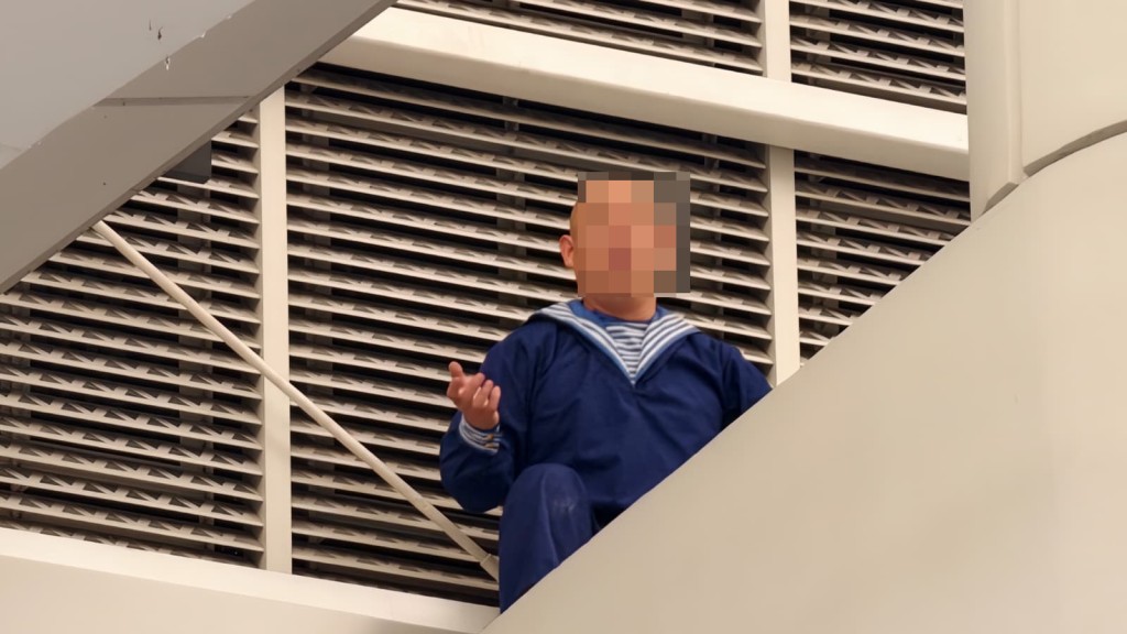 Mainland man talked down after sitting on airport departure floor ...