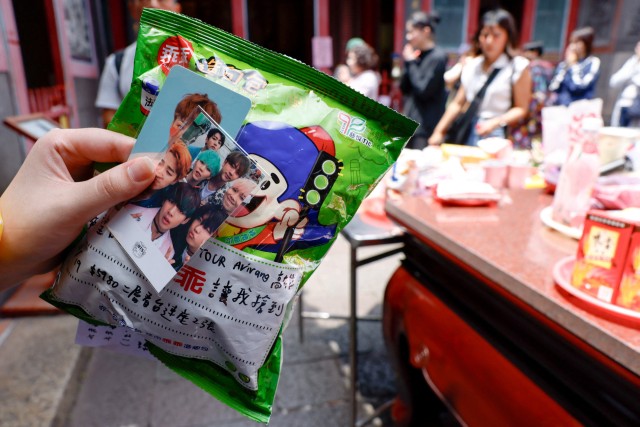 Taiwan fans seek divine help to secure K-pop band BTS concert seats